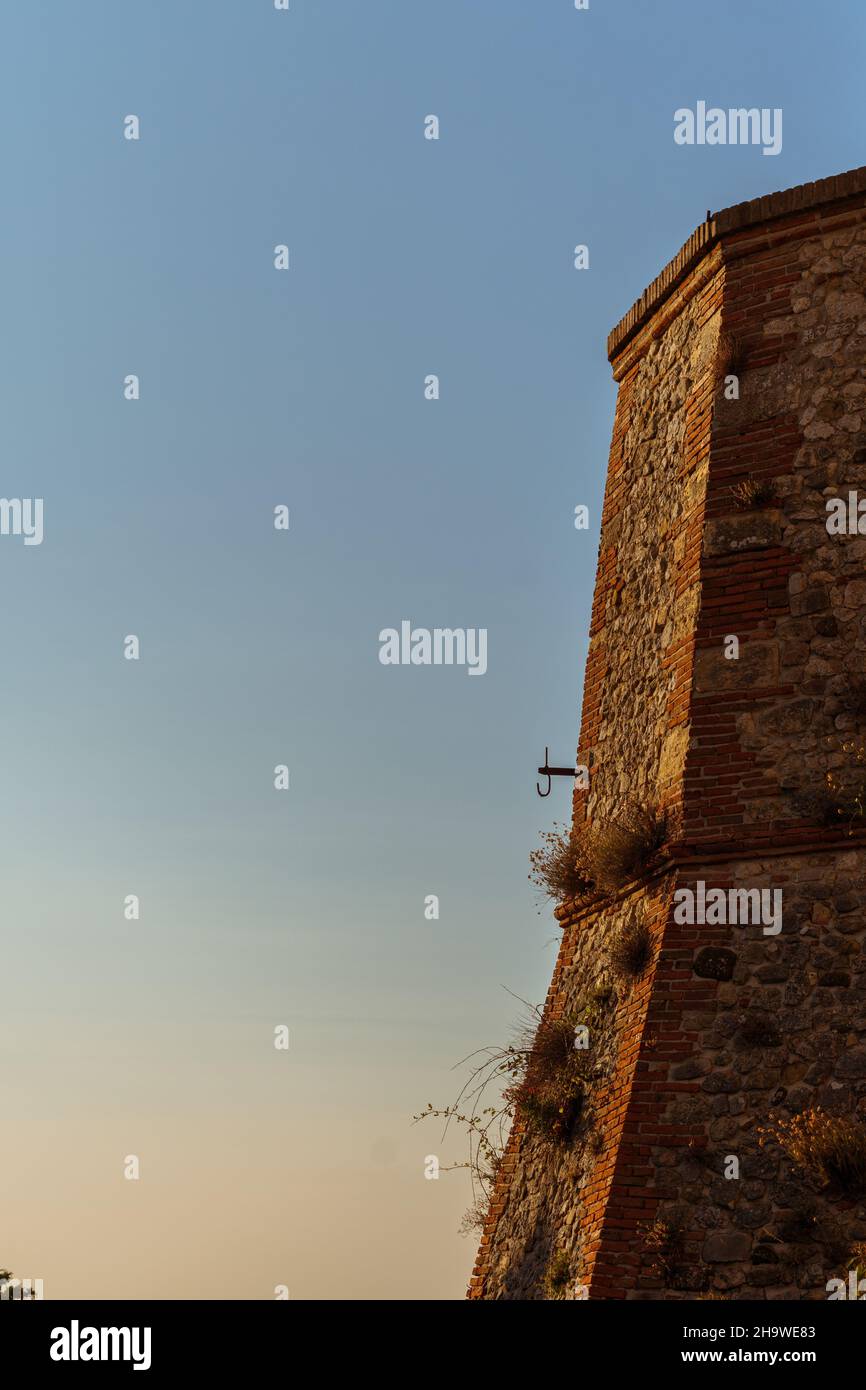 Tranquil view of an old medieval tower at golden sunset in Stock Photo ...
