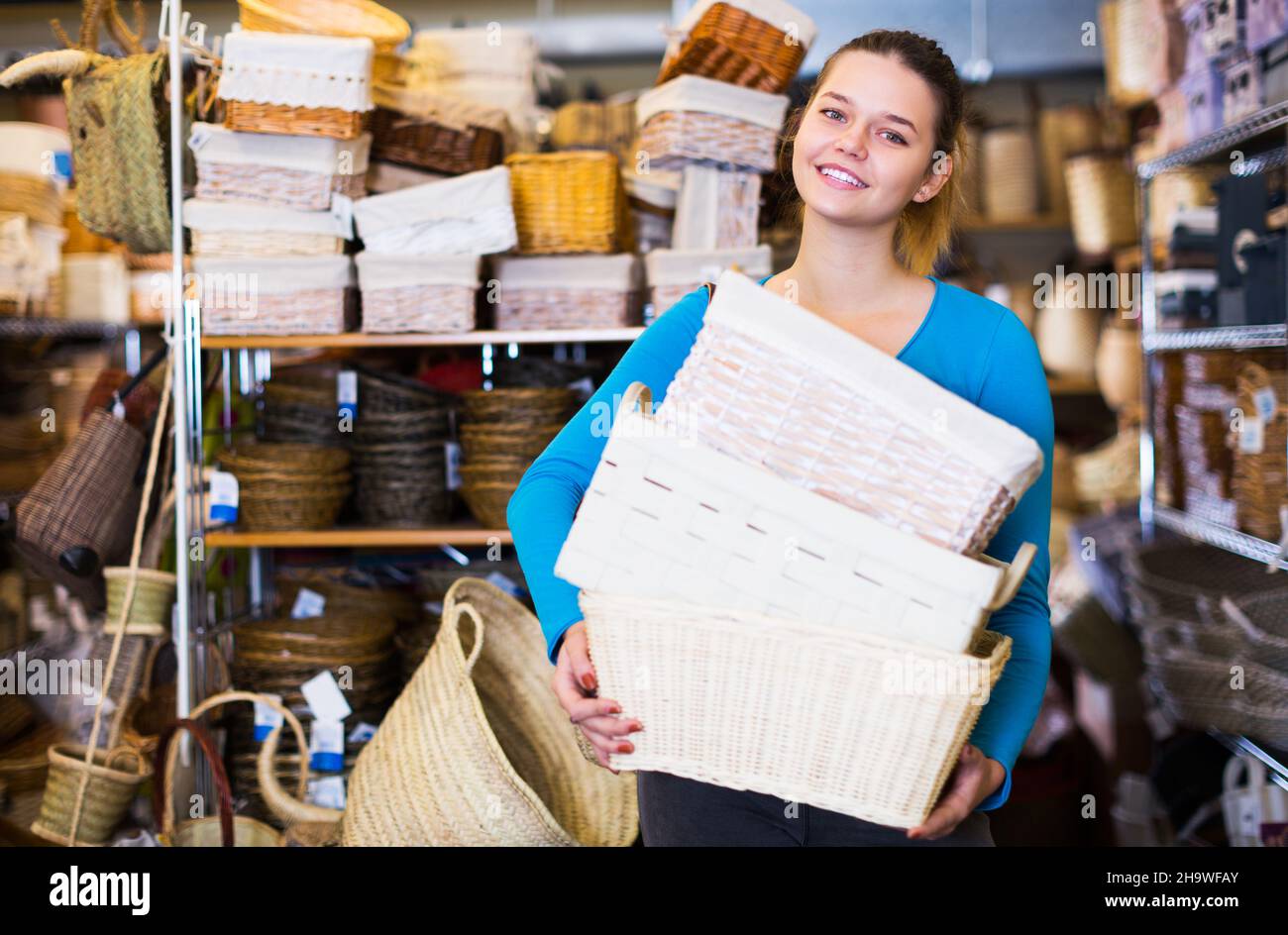 customer standing with wicker basket Stock Photo - Alamy