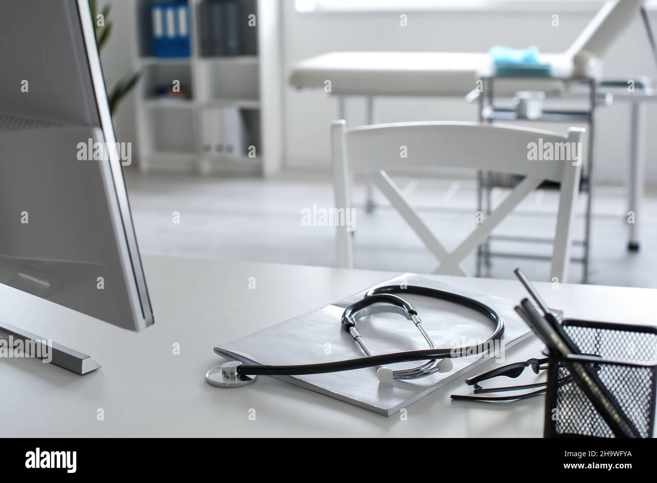 Doctor's workplace in modern clinic Stock Photo - Alamy