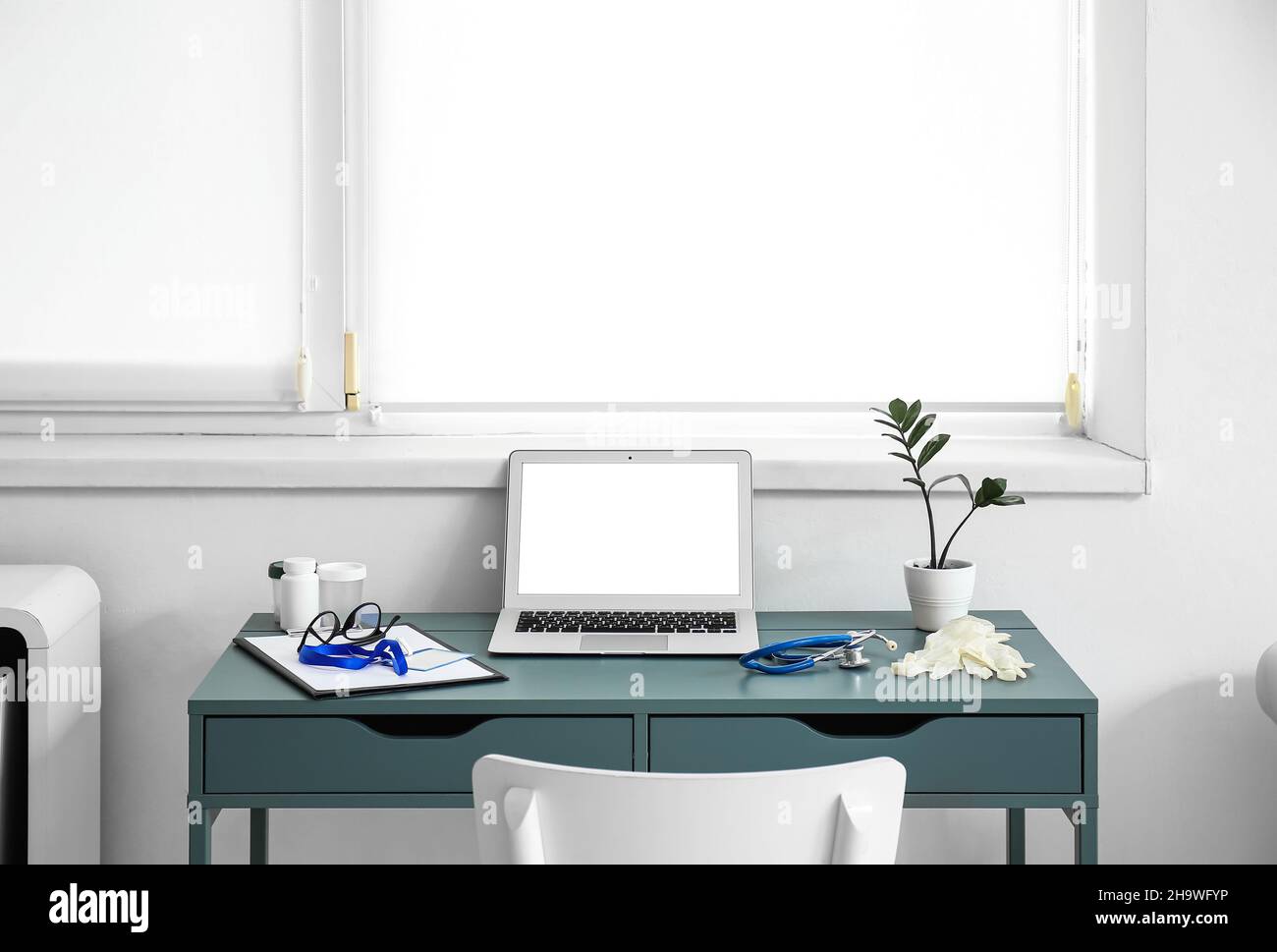 Doctor's workplace with laptop and big window in medical office Stock ...