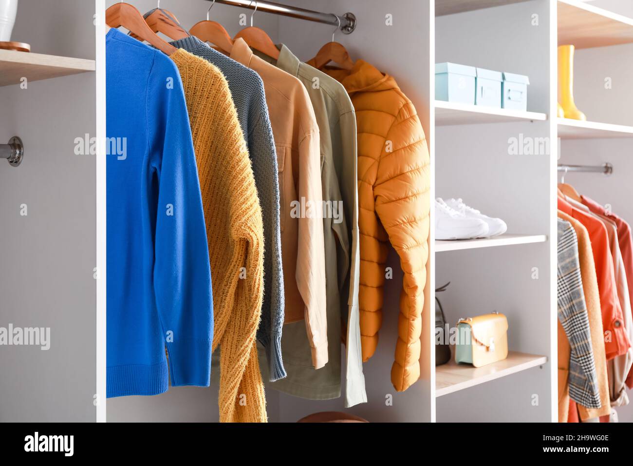 Jackets hanging in wardrobe hi-res stock photography and images - Alamy