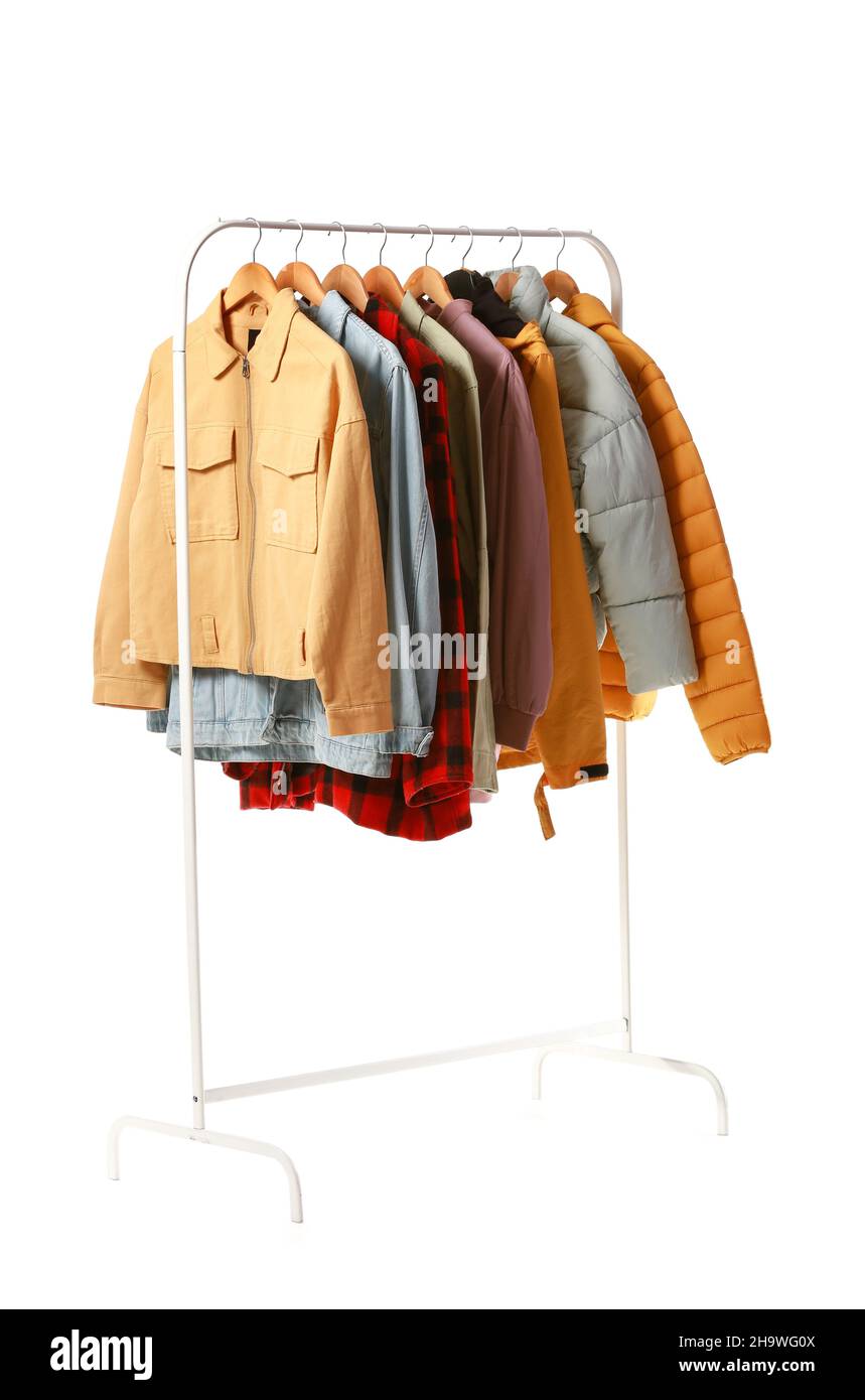 Rack with different jackets on white background Stock Photo - Alamy