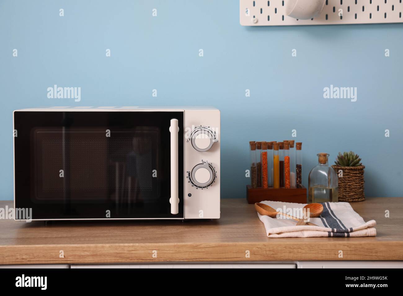 Modern microwave oven in kitchen Stock Photo - Alamy