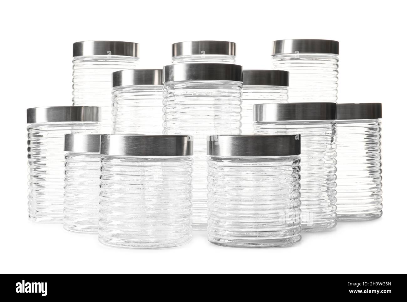 Many different glass jars on white background Stock Photo - Alamy