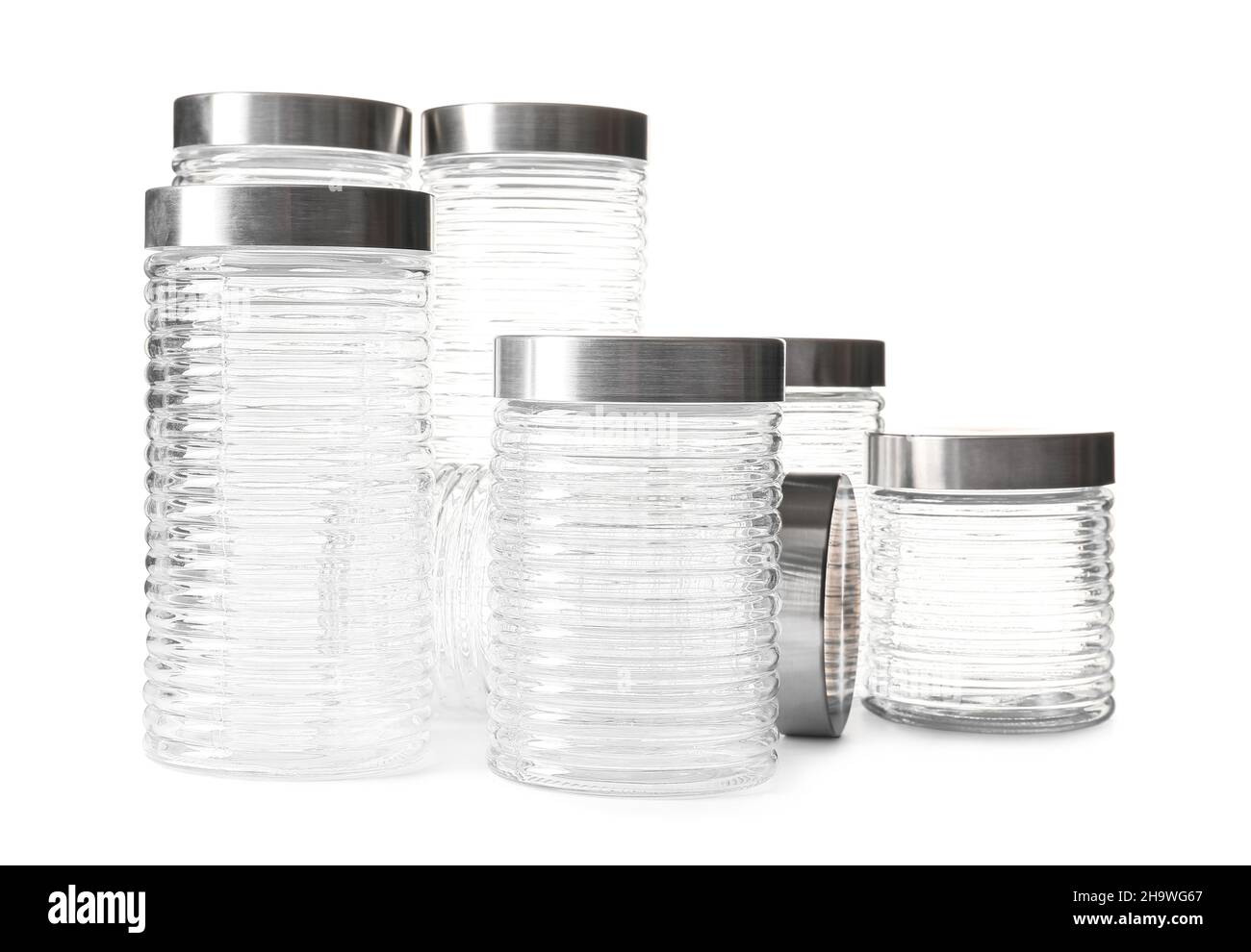 Many different glass jars on white background Stock Photo - Alamy
