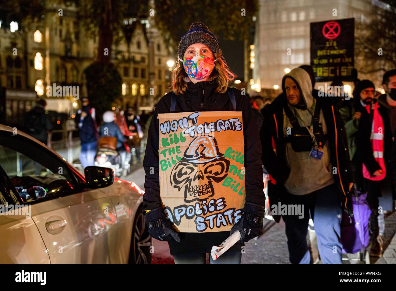 A Protester Holds A Placard Expressing Her Opinion During The