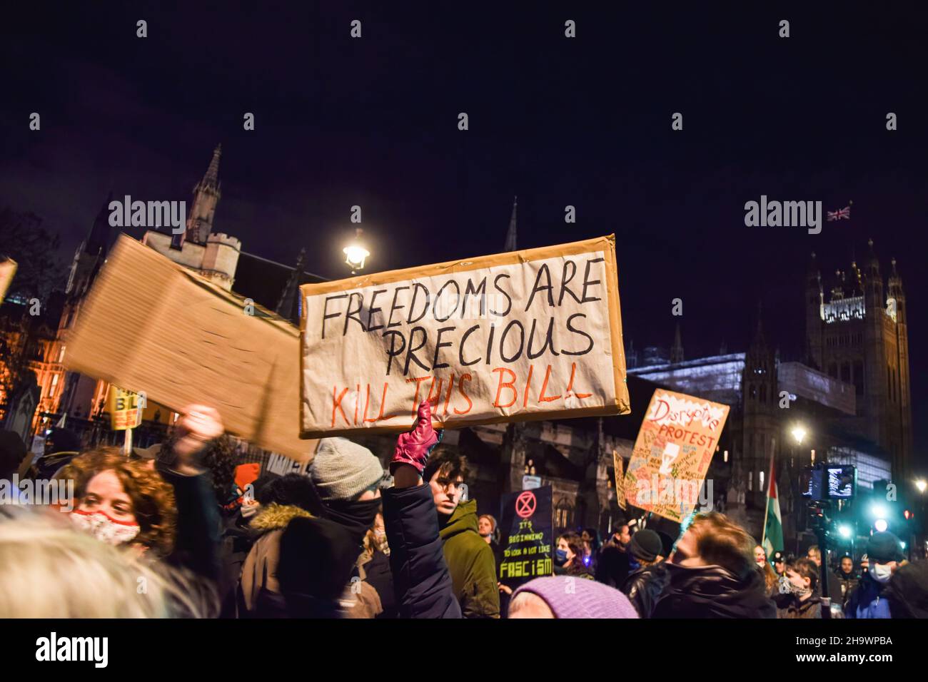 London, UK. 08th Dec, 2021. A protester holds a 'Freedoms Are Precious ...