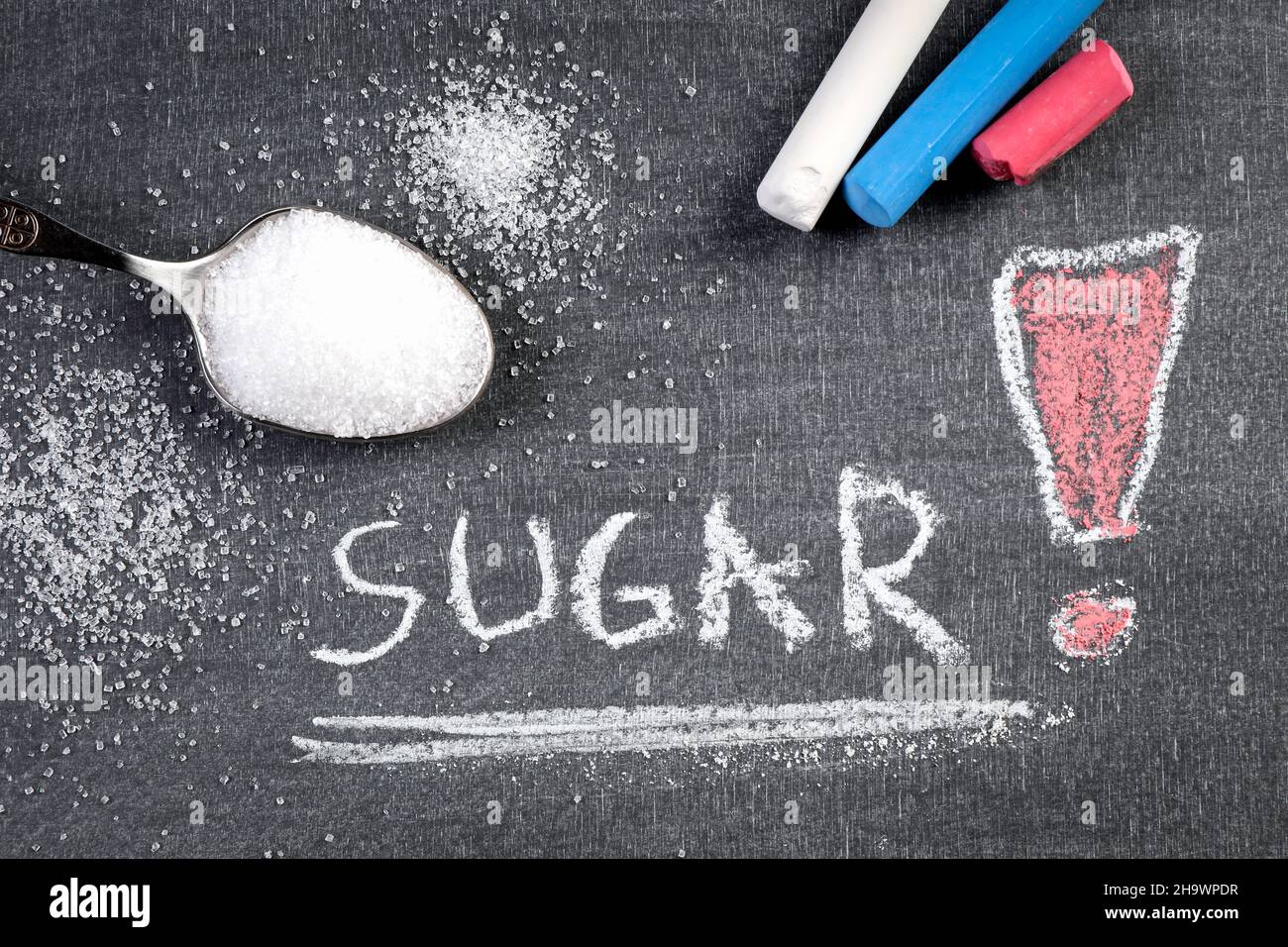 SUGAR. Word written with chalk on a blackboard Stock Photo - Alamy