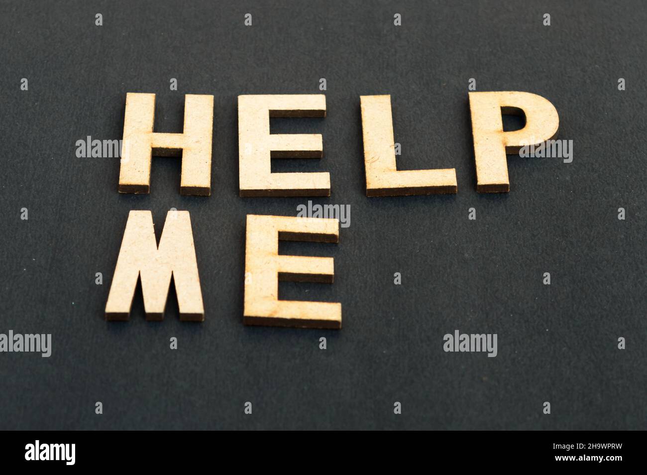 Help me symbol. Wooden cubes words help me isolated on black background ...