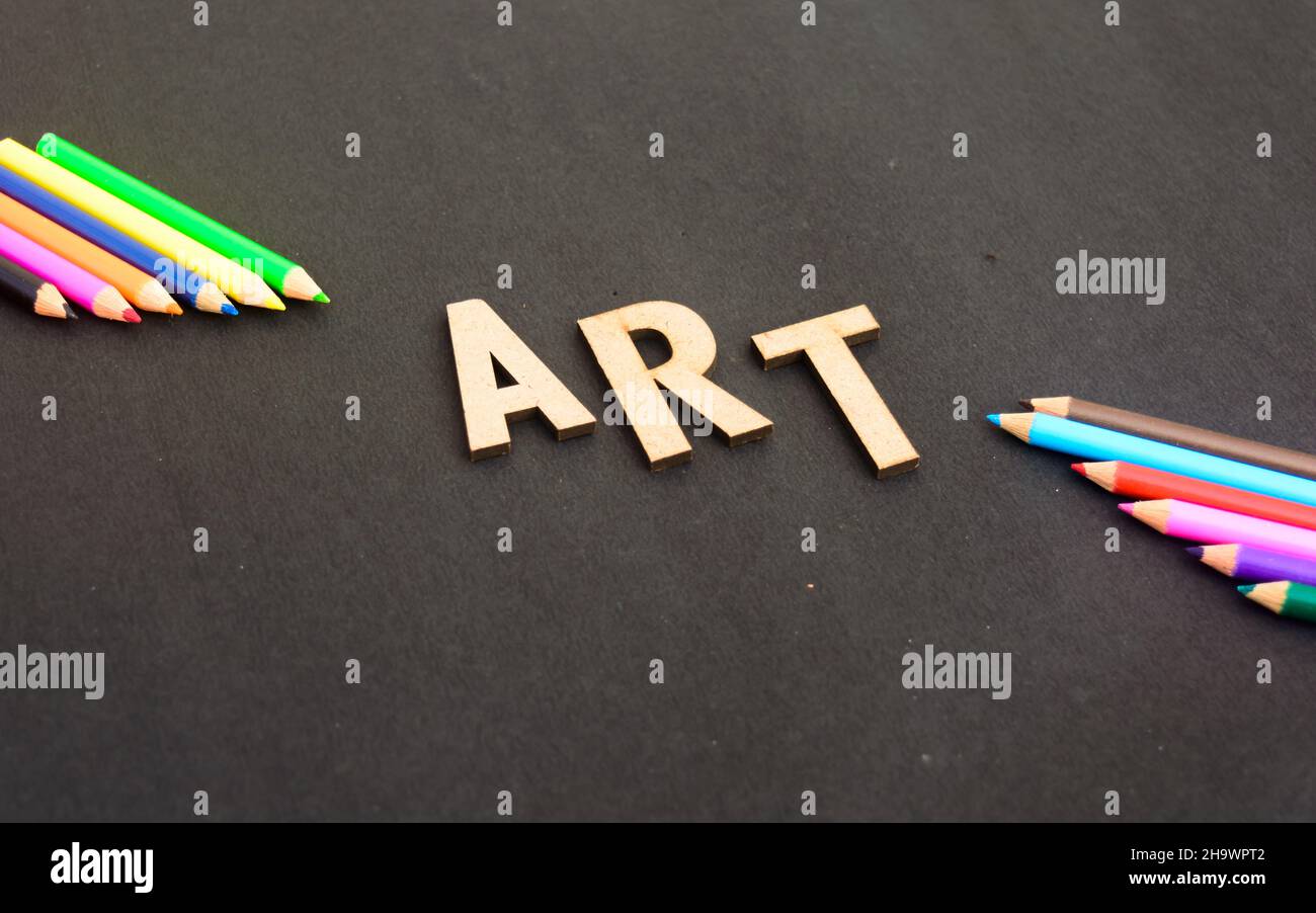 Art design background with color pencils and typography lettering ...