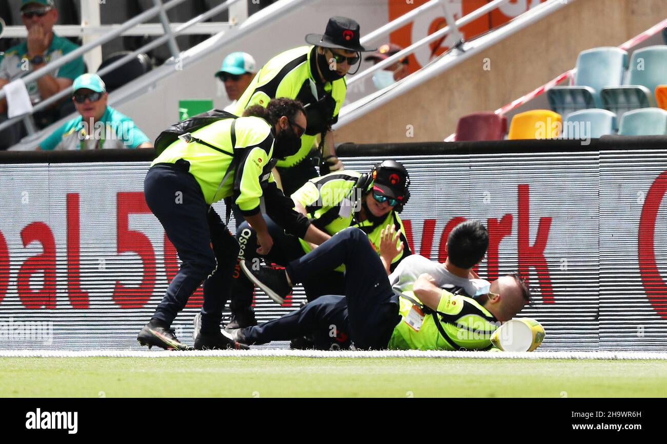 A pitch invader enters the field during day two of the first Ashes test ...