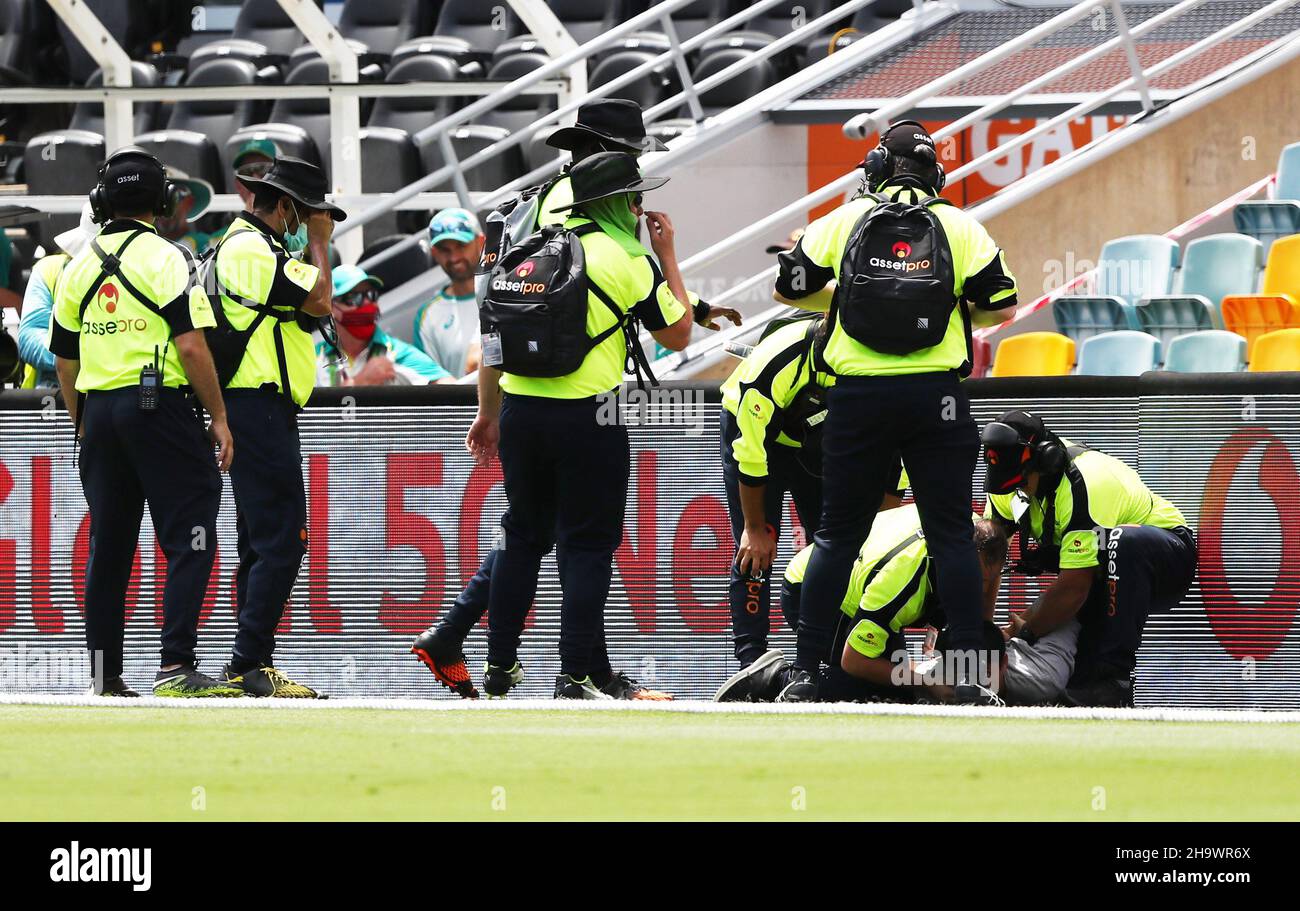 A pitch invader enters the field during day two of the first Ashes test ...