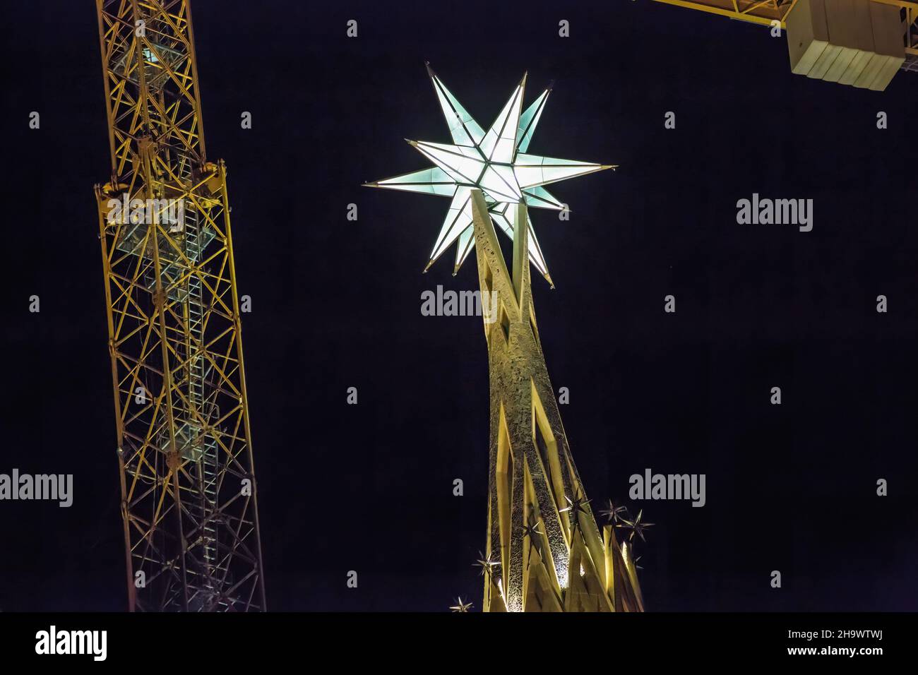 Twelve-pointed star is illuminated from the top of one of the towers of ...