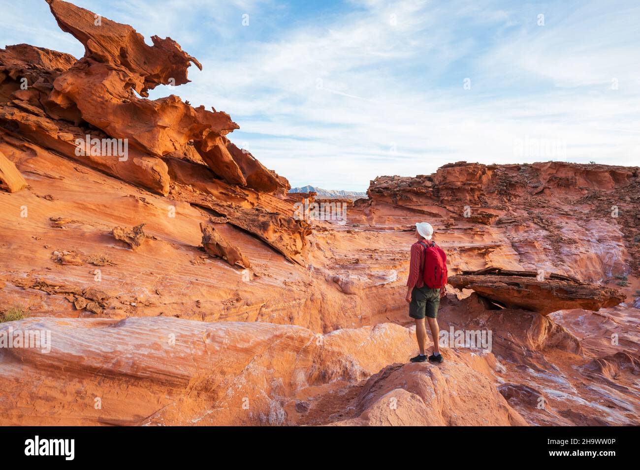 Hiker inside a stone arch in the Nevada desert near Las Vegas, Nevada ...