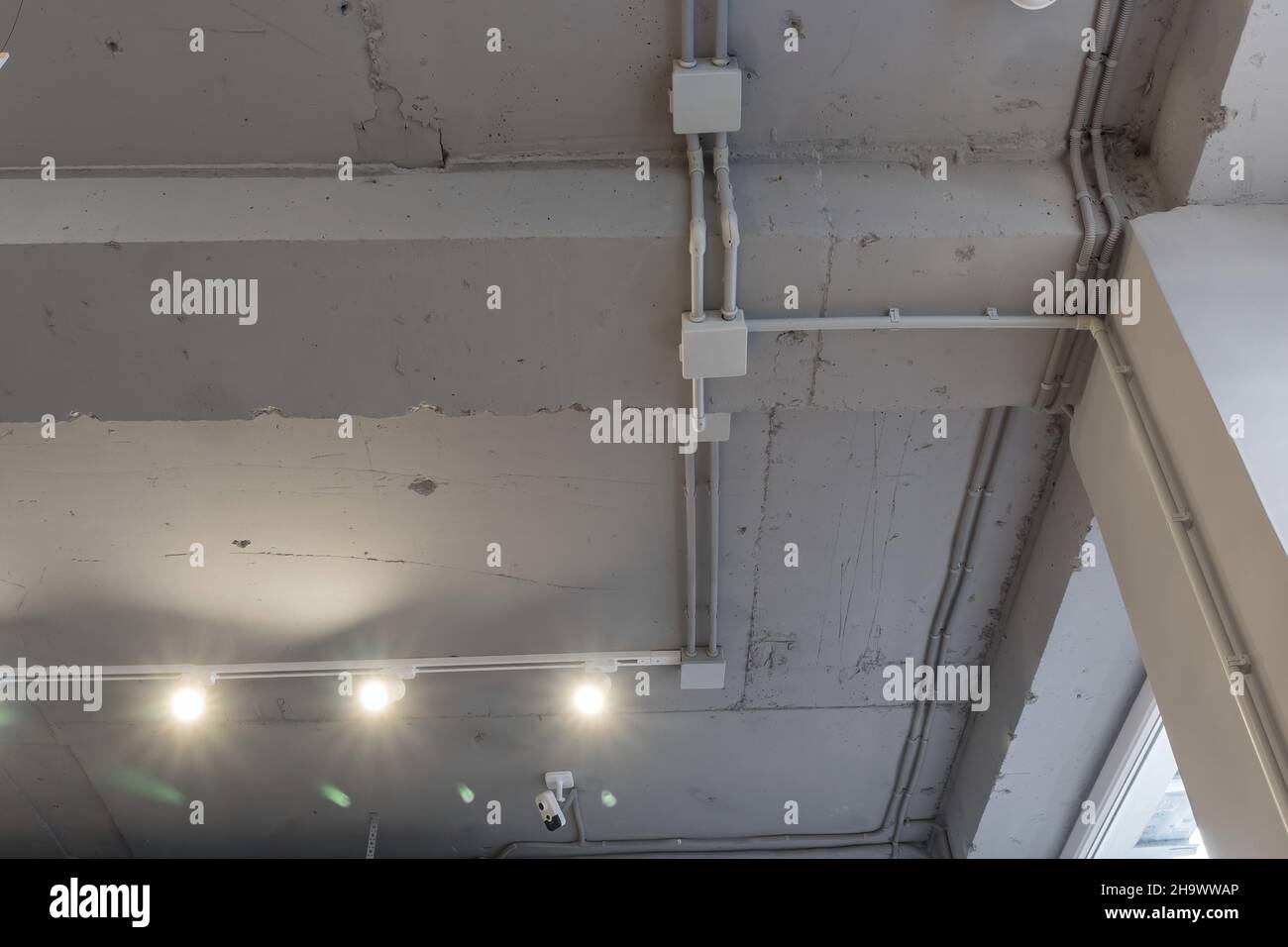 Abstract loft interior of concrete grey ceiling with air ventilation ...