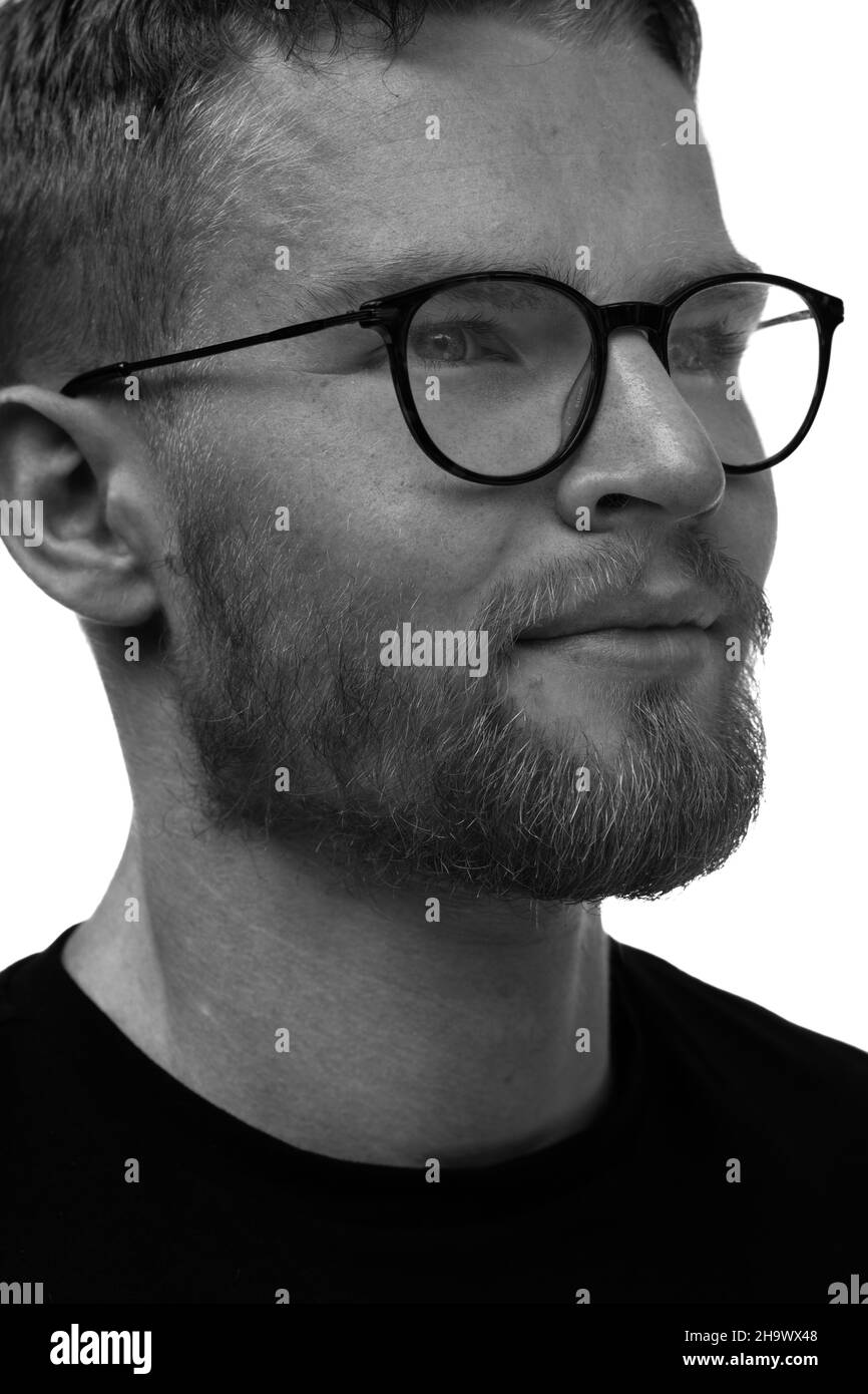 A Black And White Portrait Of A Young Attractive Man With Glasses On A White Background Stock