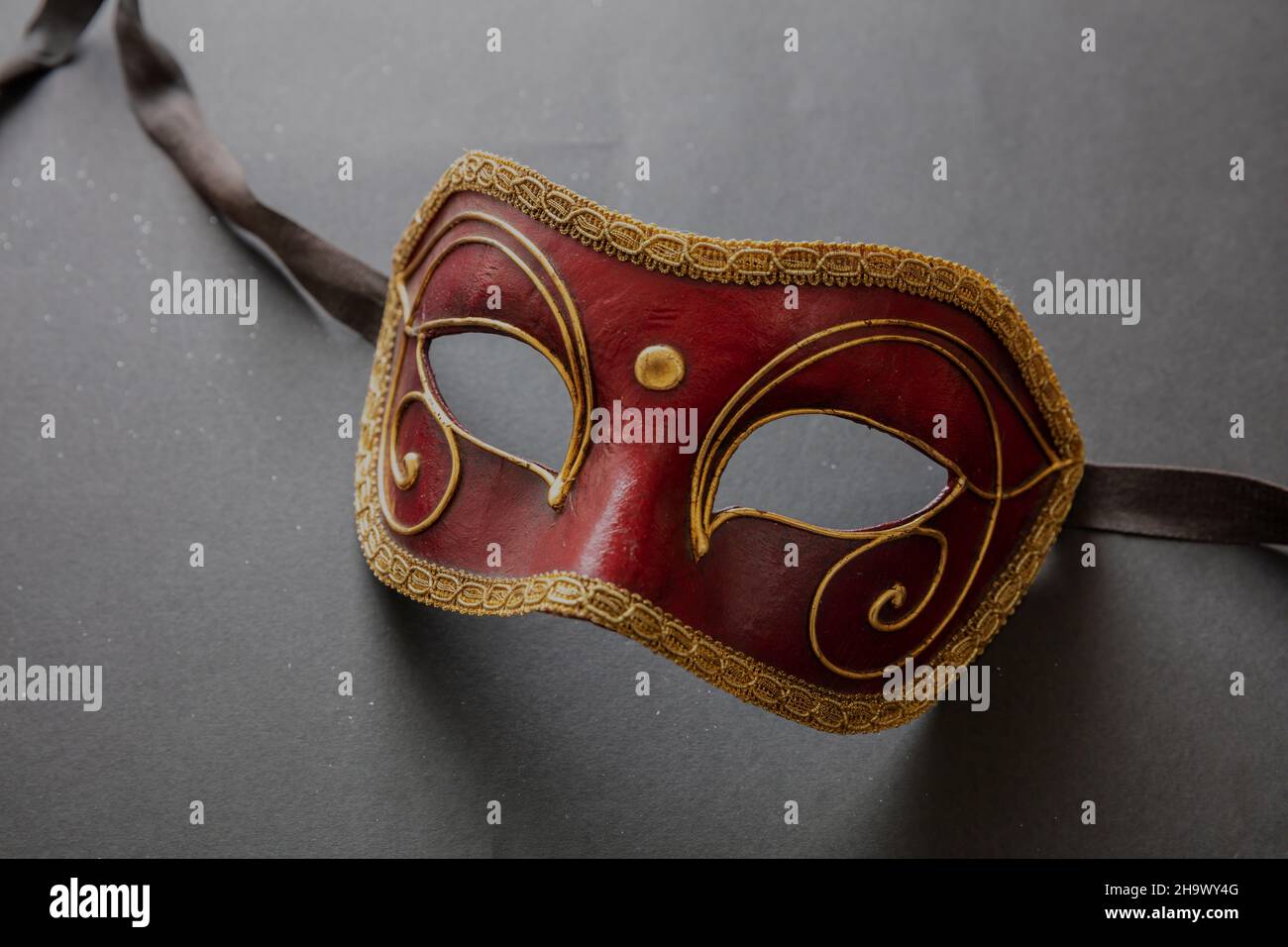 Carnival Venetian mask red color handmade on black color background ...