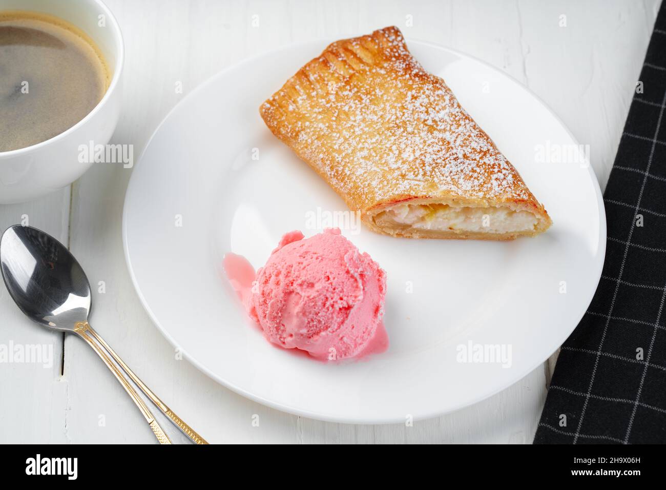 Classic shtrudel dessert with ice cream on white plate Stock Photo - Alamy