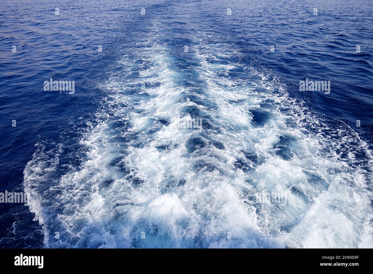 Wake of boat on water surface Stock Photo - Alamy