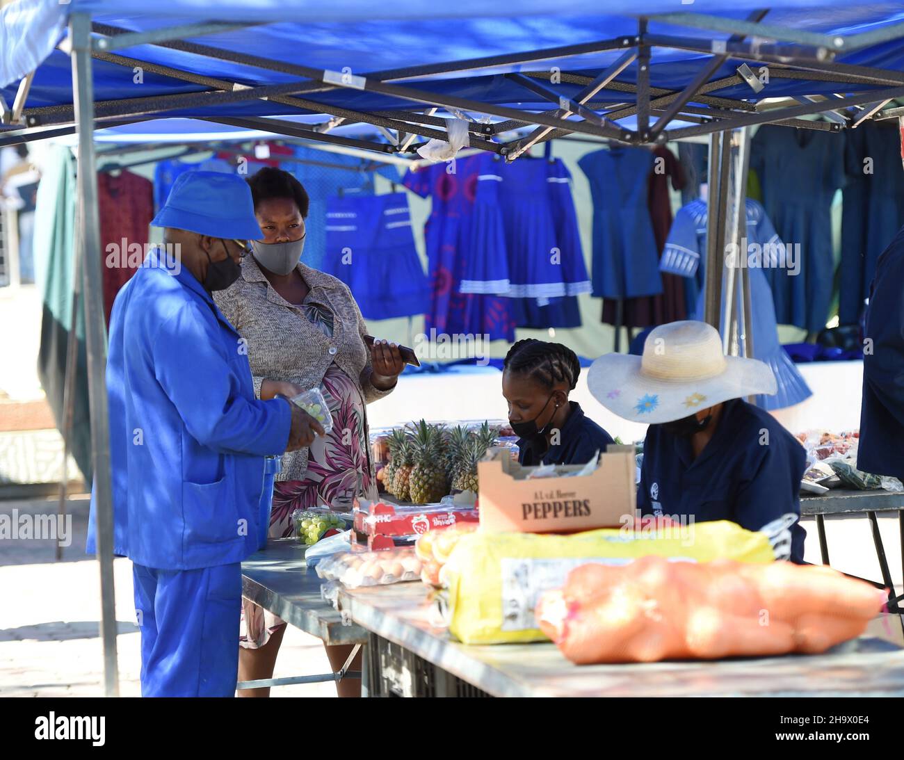 Gaborone, Botswana's capital city. 8th Dec, 2021. Residents wearing ...