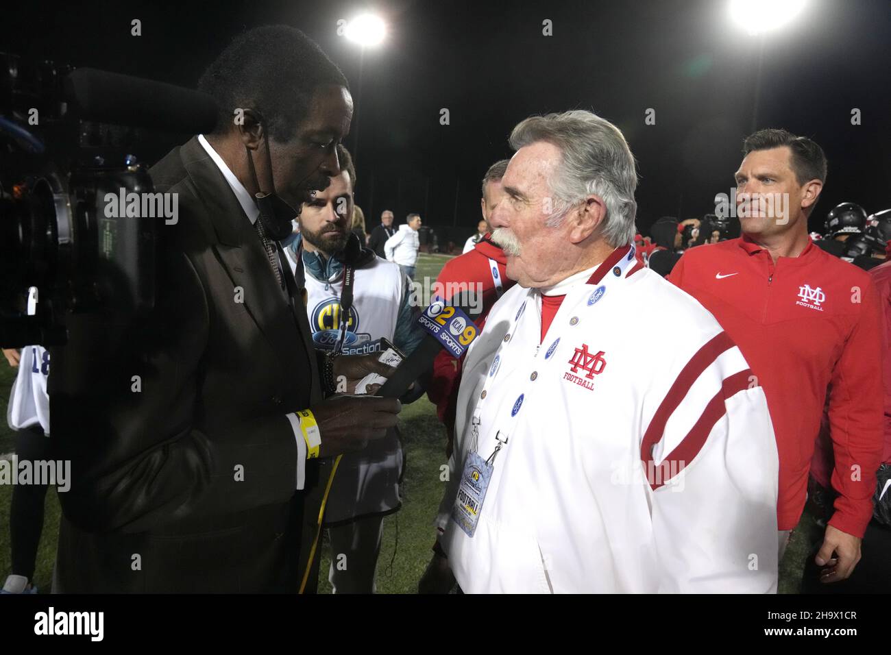 Mater Dei Monarchs coach Bruce Rollinson (right) is interviewed by KCBS ...
