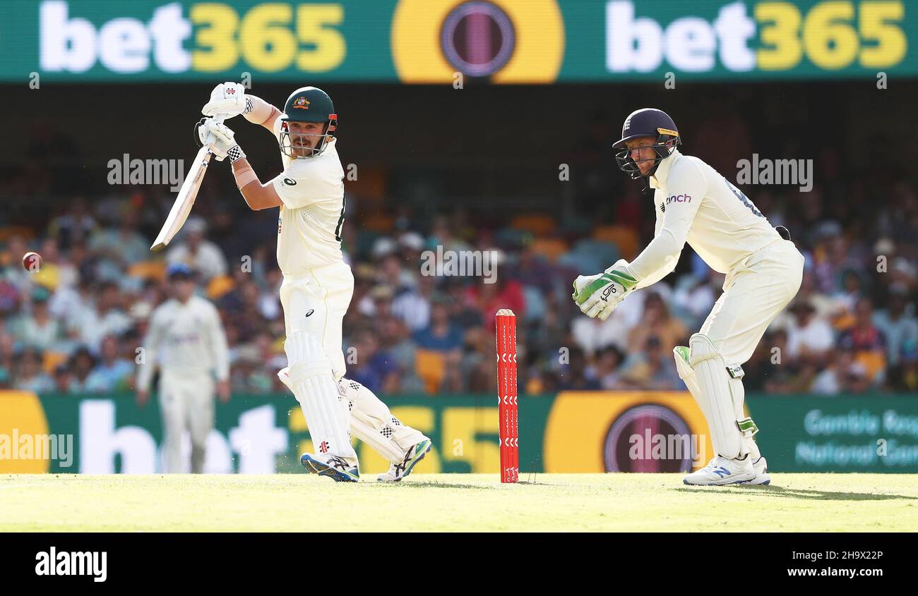 Australia's Travis Head in action as England's Jos Buttler looks on ...
