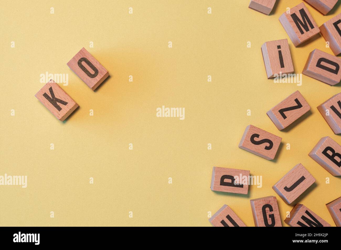 Word K.O., taken from a pile of wooden letter blocks in the yellow ...