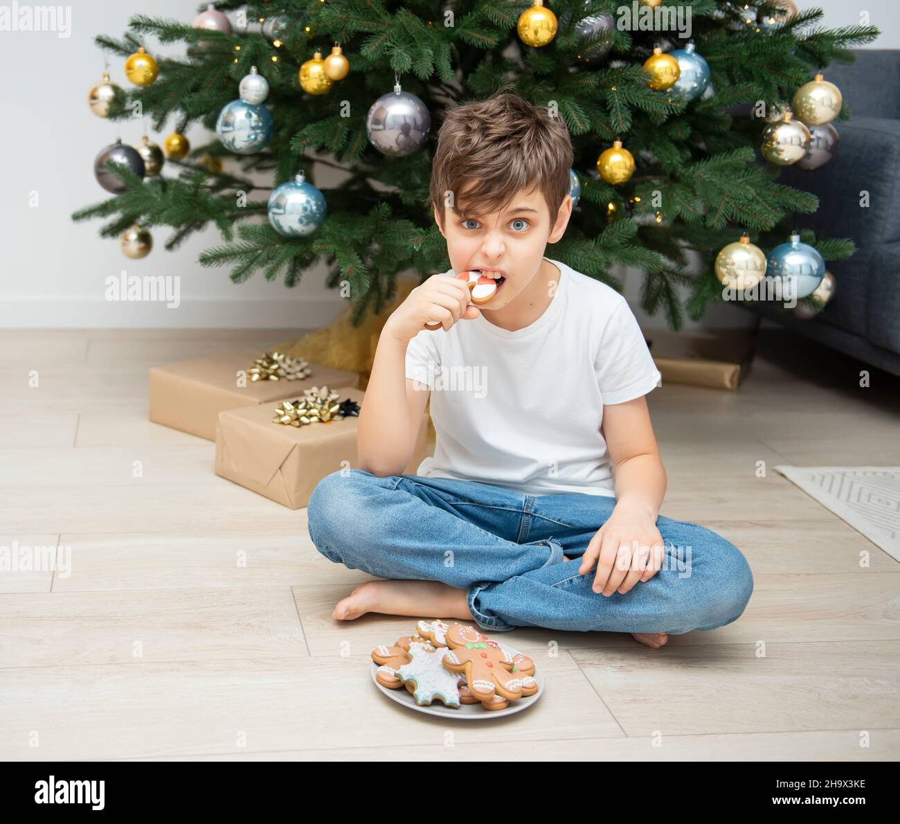 Boy eating biscuits hi-res stock photography and images - Alamy