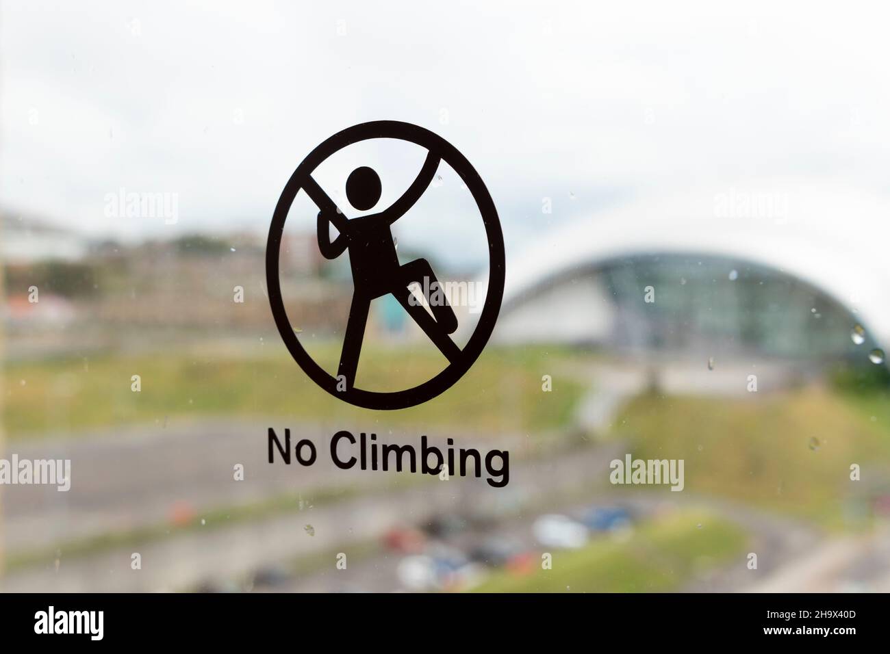 no climbing warning symbol decal on window in the baltic arts centre ...