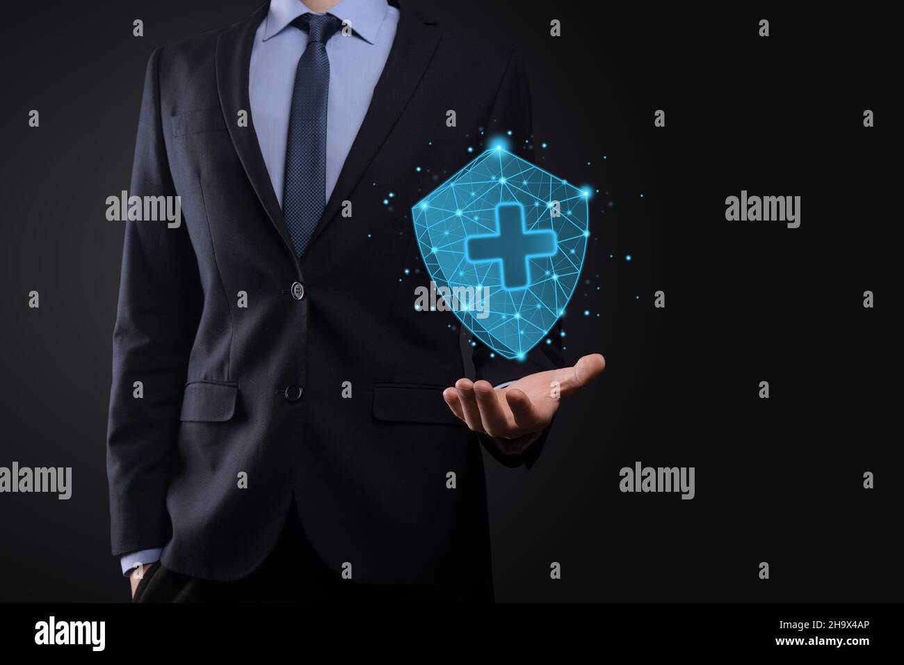 Businessman hold Shield with plus Low polygonal icon, medicine icon ...