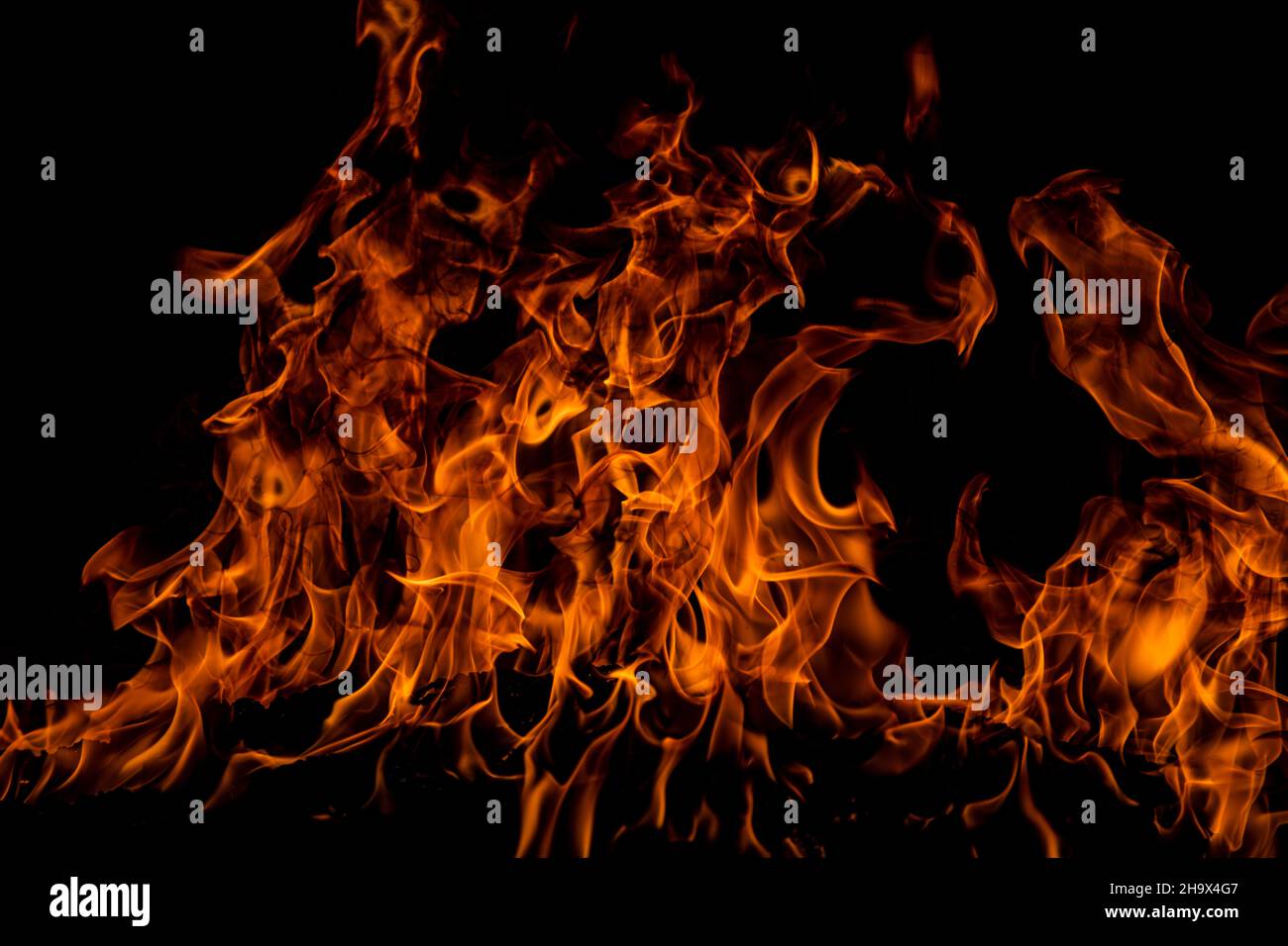 Texture of fire on a black background. Abstract fire flame background ...