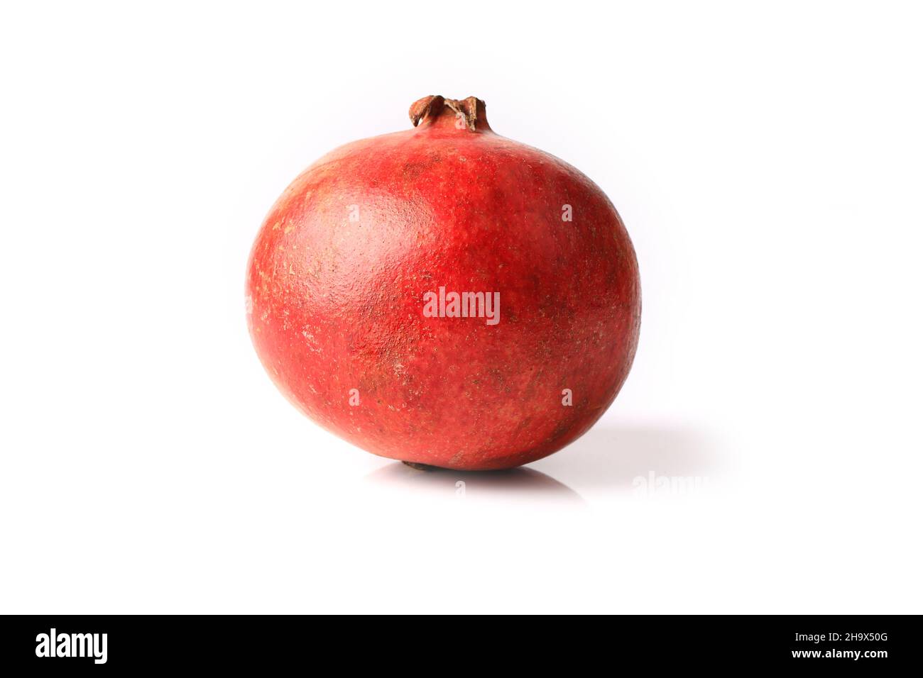 whole pomegranate isolated on white background Stock Photo - Alamy