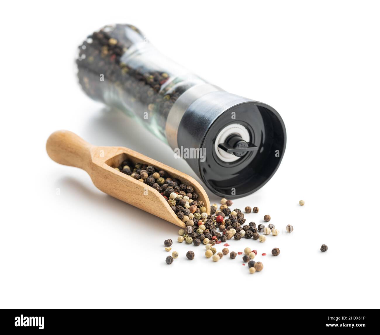 Whole pepper in wooden scoop isolated on white backgrund Stock Photo ...