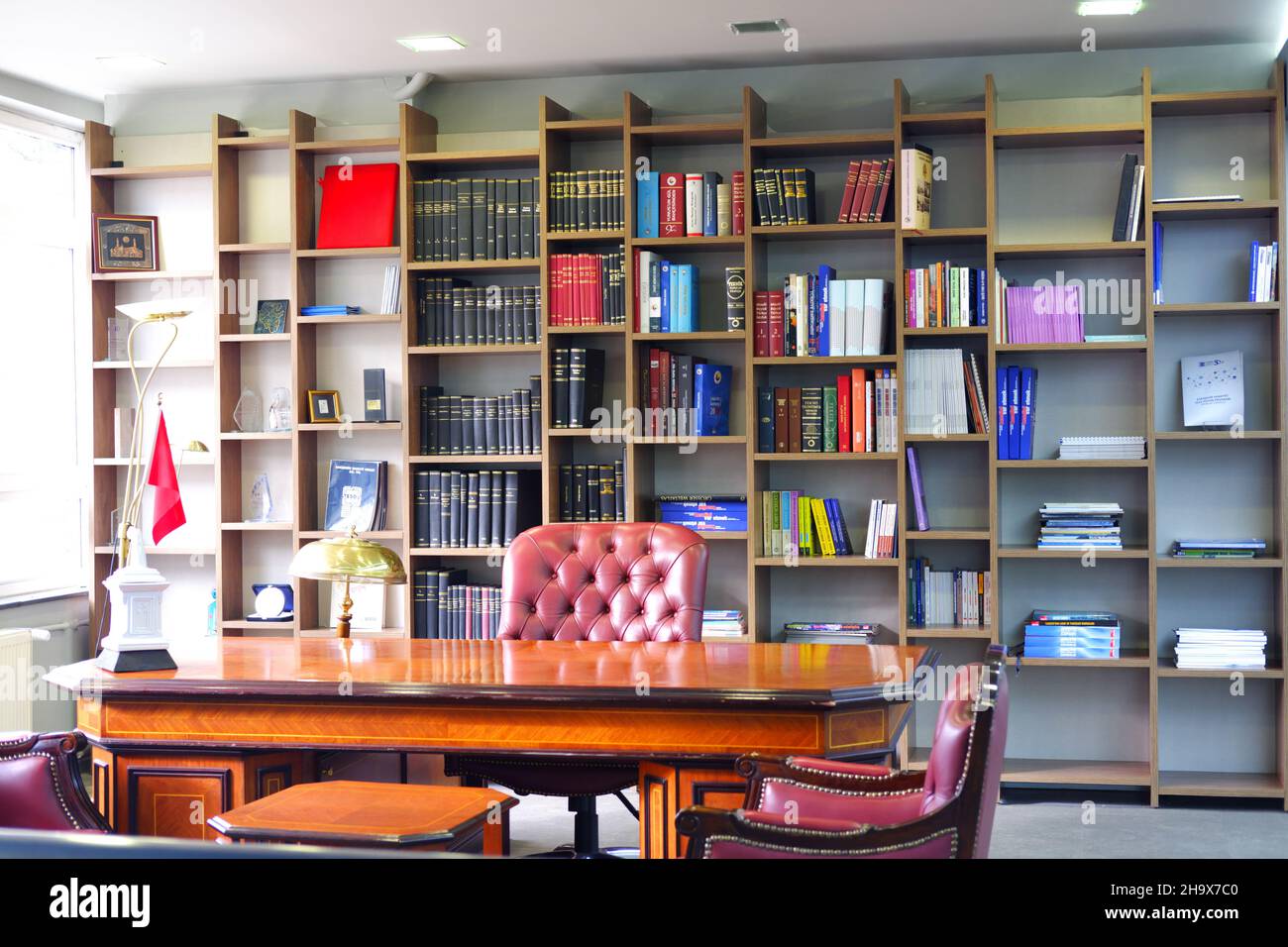 Vintage Boss Desk and Leather Chair with Bookshelf at the Background ...