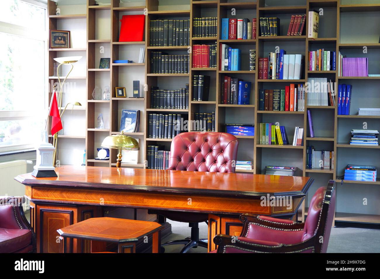 Vintage Boss Desk and Leather Chair with Bookshelf at the Background ...