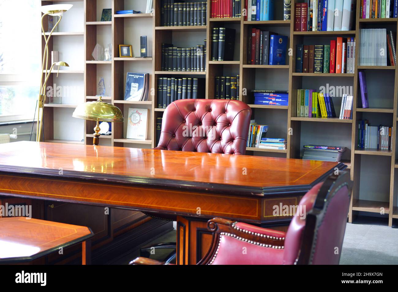 Vintage Boss Desk and Leather Chair with Bookshelf at the Background ...