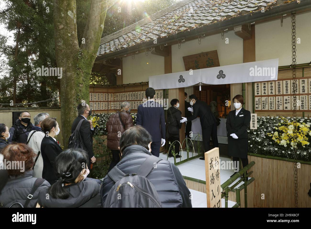 People arrive at the home of the late Japanese novelist and Buddhist ...