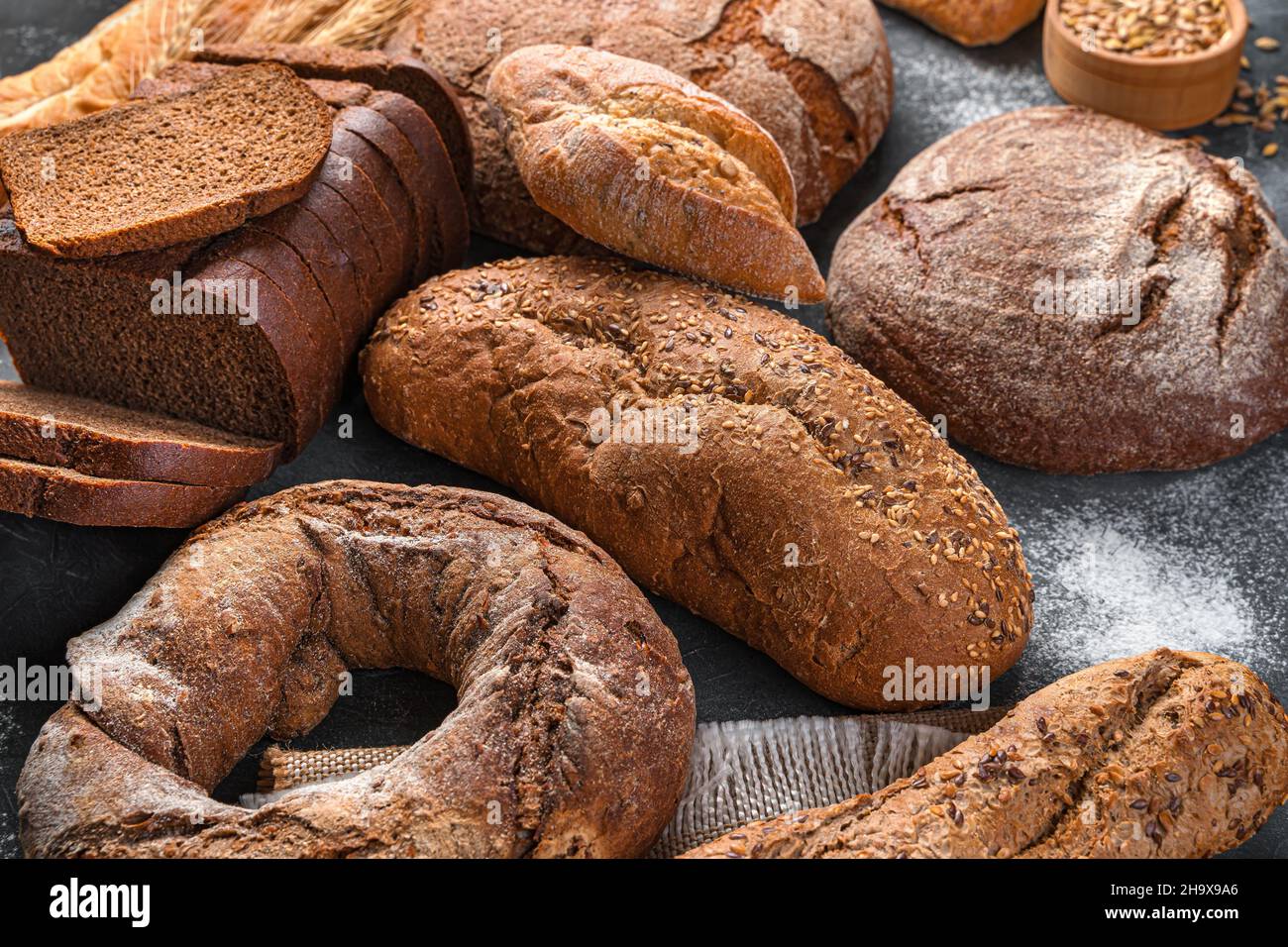 Bread of different types in close-up. Bakery products. Side view Stock ...