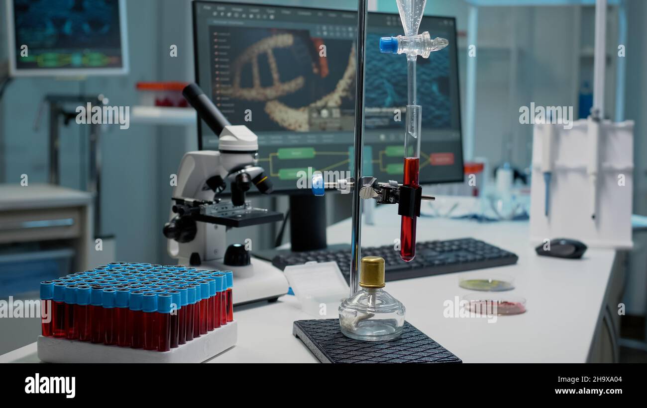 Desk with chemical equipment for experiment with test tube in ...