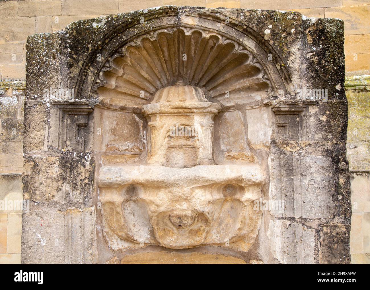 Historic carved stonework of water fountain in village of Laguardia ...