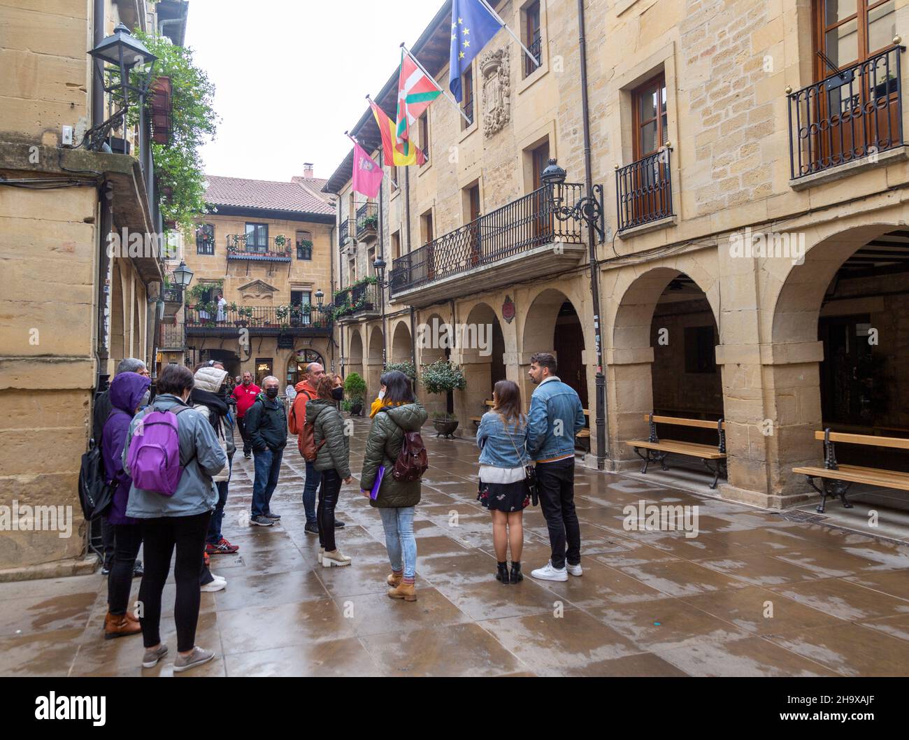 Tour group at Ayuntamiento building in Plaza Mayor, village of ...