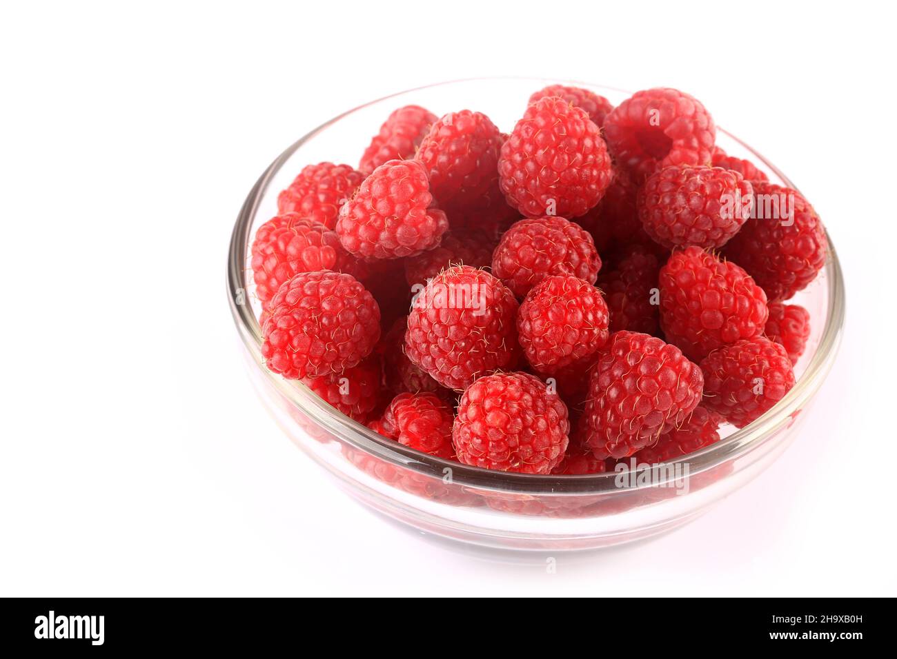 raspberry in bowl isolated on white background Stock Photo - Alamy