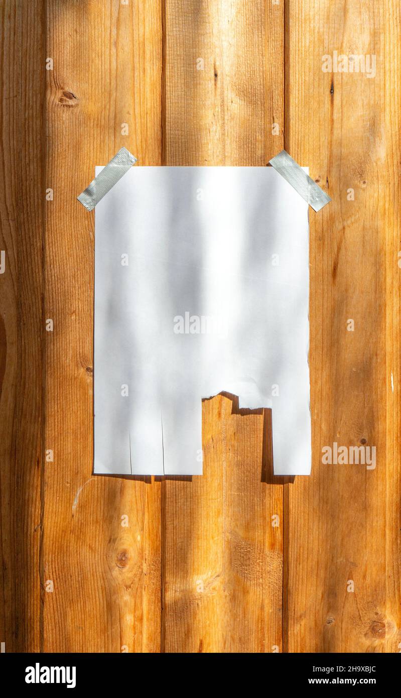 Tear off paper on wood wall. Mock up template. Street paper ad or ...