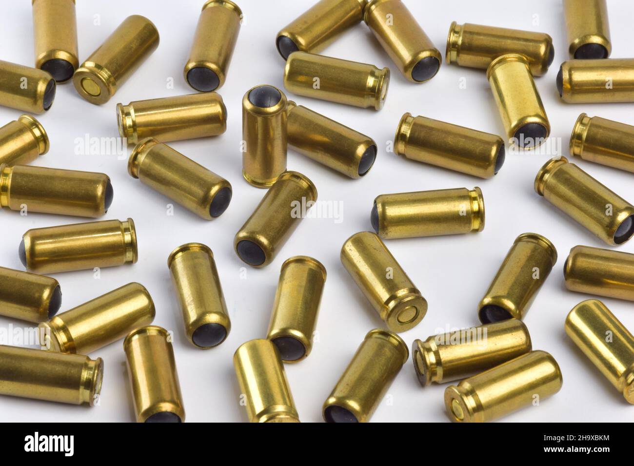 Close-up shot of a lot of bullets scattered all over the frame on a ...