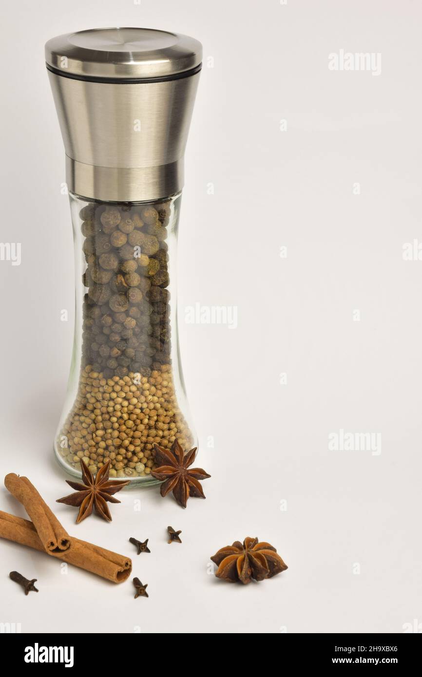 Pepper mill with different types of peppers in layers, as well as stars ...