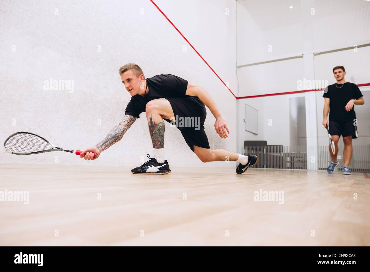 Full-length portrait of two young sportive boys training together ...