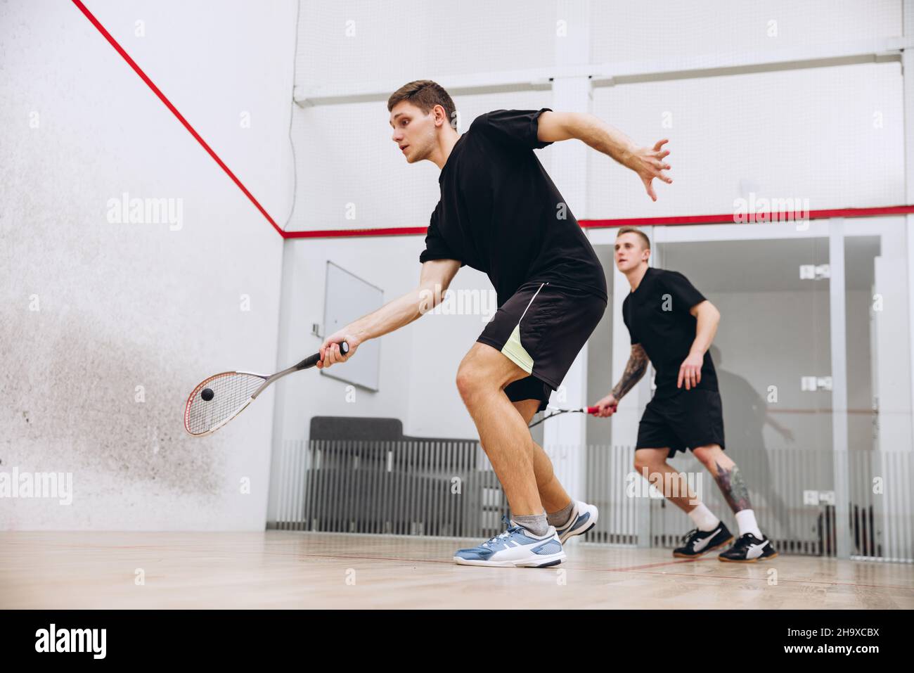 Full-length side view portrait of two young boys in motion, playing ...