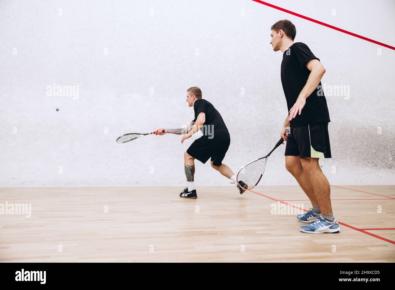 Full-length side view portrait of two young boys in motion, playing ...