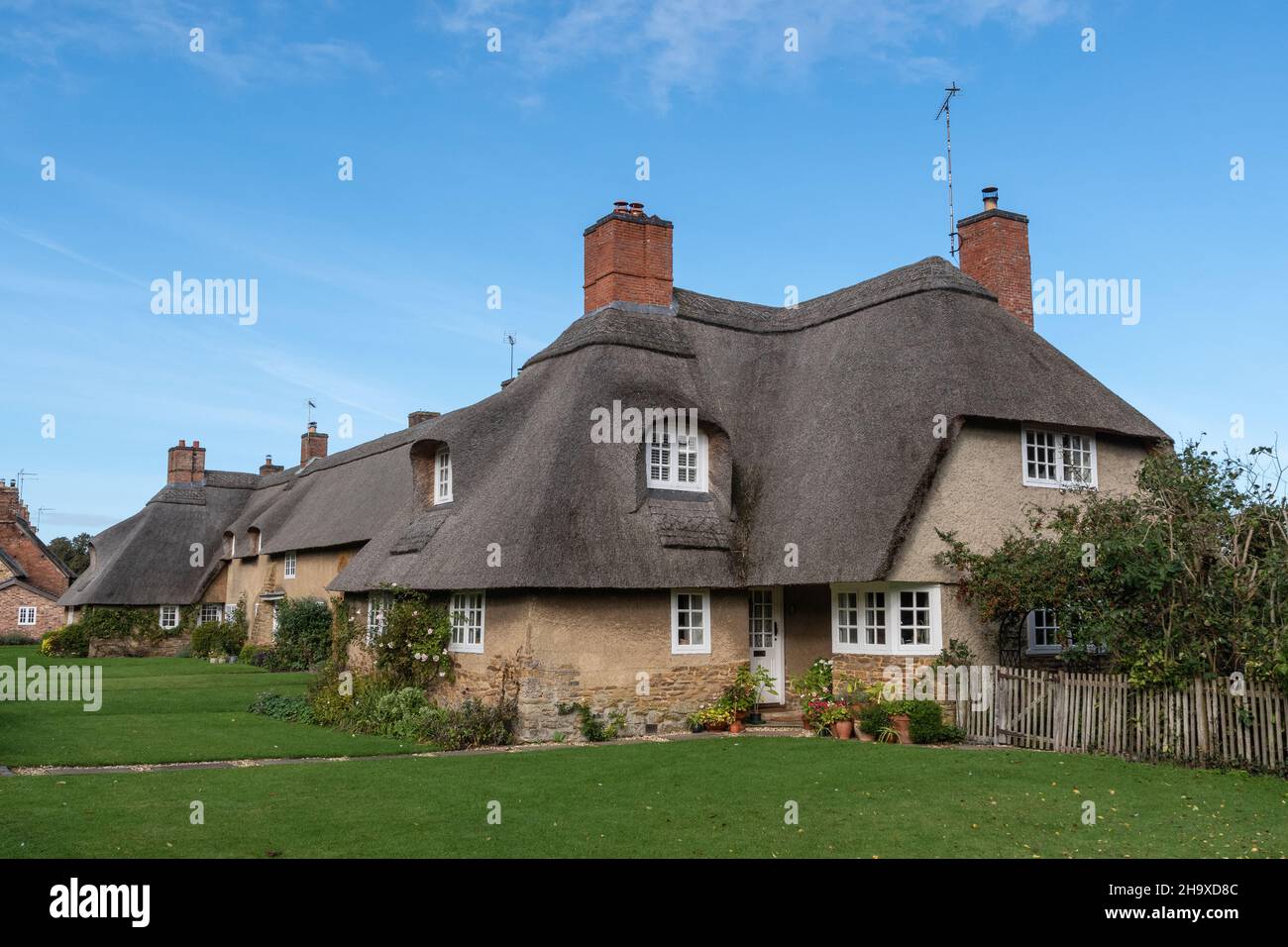 A picturesque row of thatched cottages designed by Sir Edwin Luytens in ...