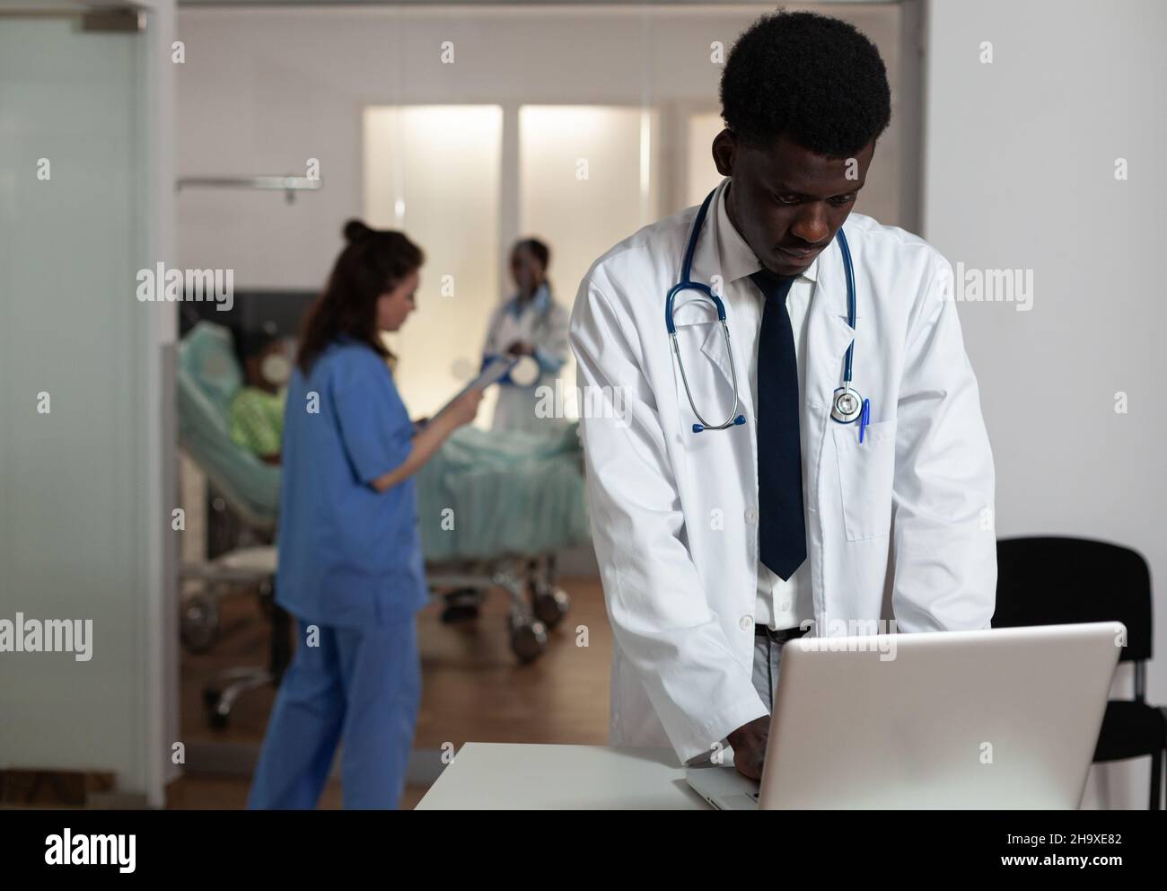 Therapist man nurse typing disease hi-res stock photography and images ...